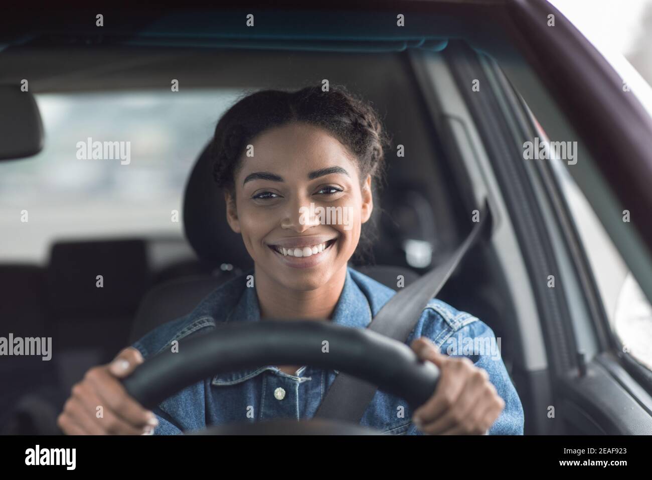 Happy woman driving car and smiling going to work or on road trip Stock ...