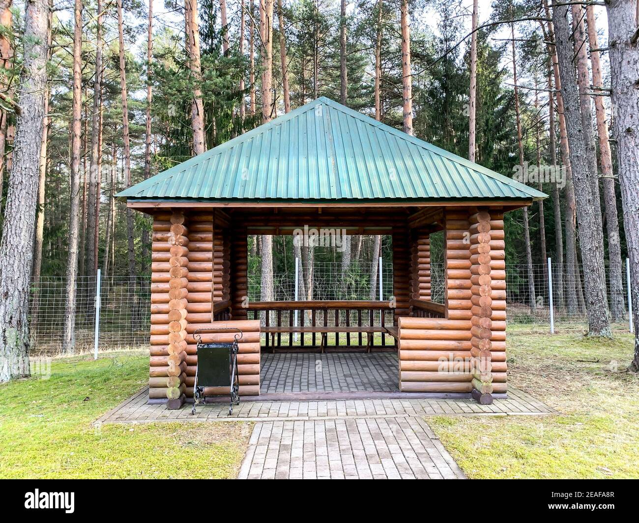 Large wooden gazebo on background of forest Stock Photo - Alamy