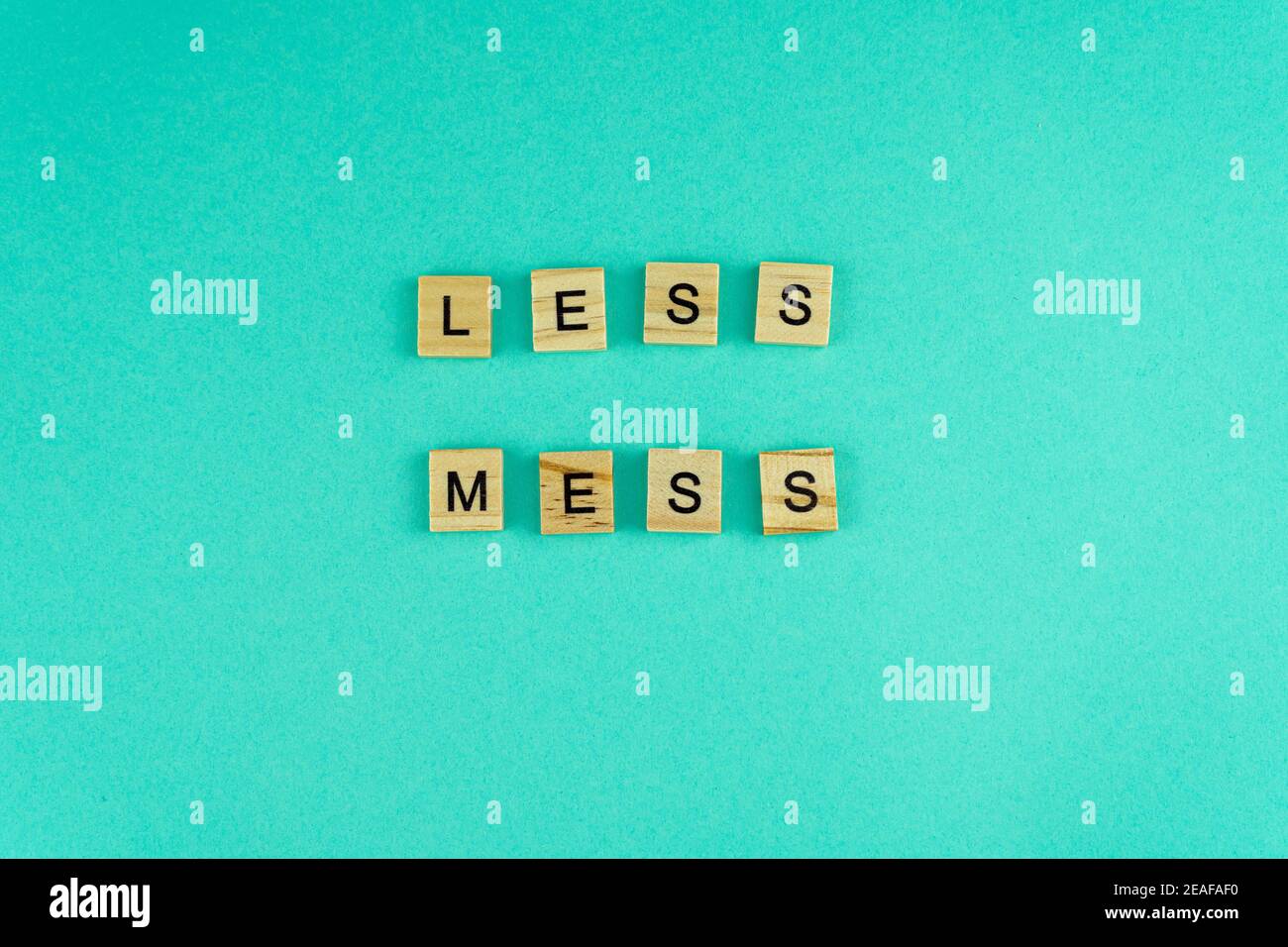 Word less mess. The phrase is laid out in wooden letters. Top view ...