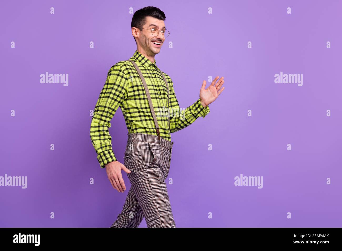 Profile side photo of young handsome shocked smiling man walk ...