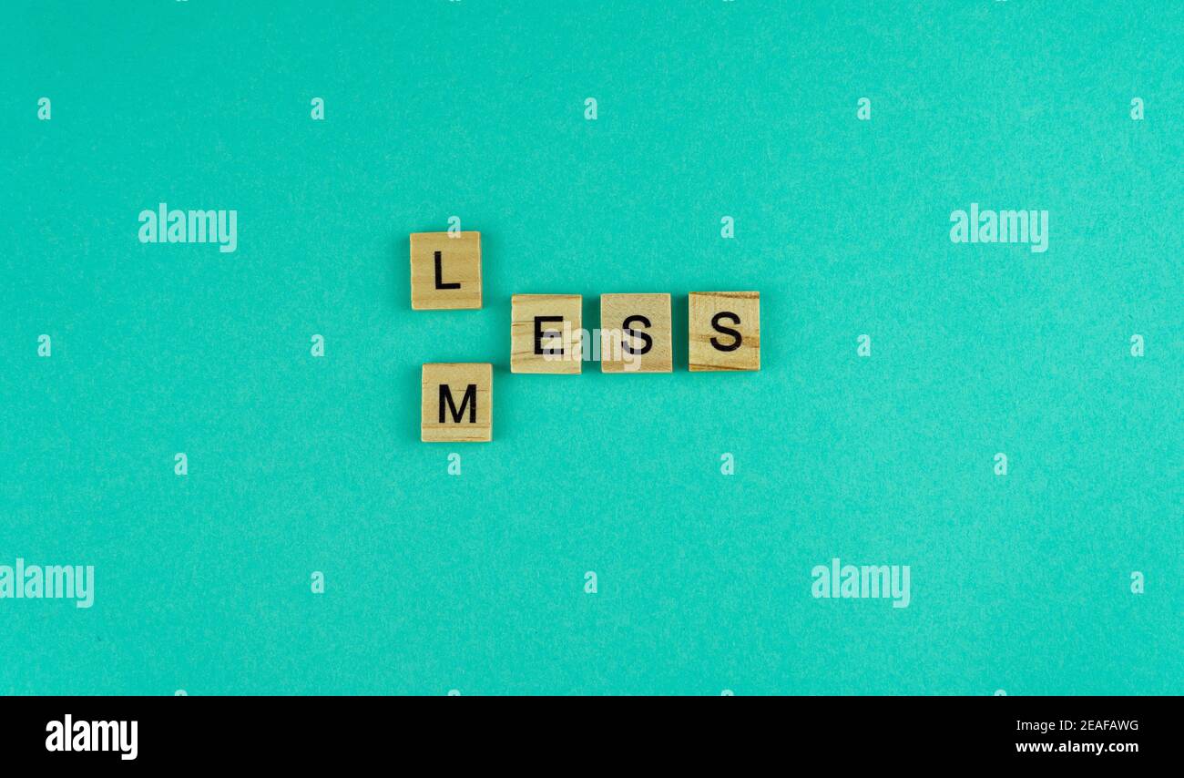 Word less mess. The phrase is laid out in wooden letters. Top view ...