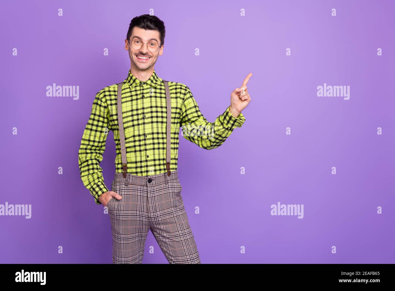 Photo of young happy positive good mood smiling man pointing finger ...