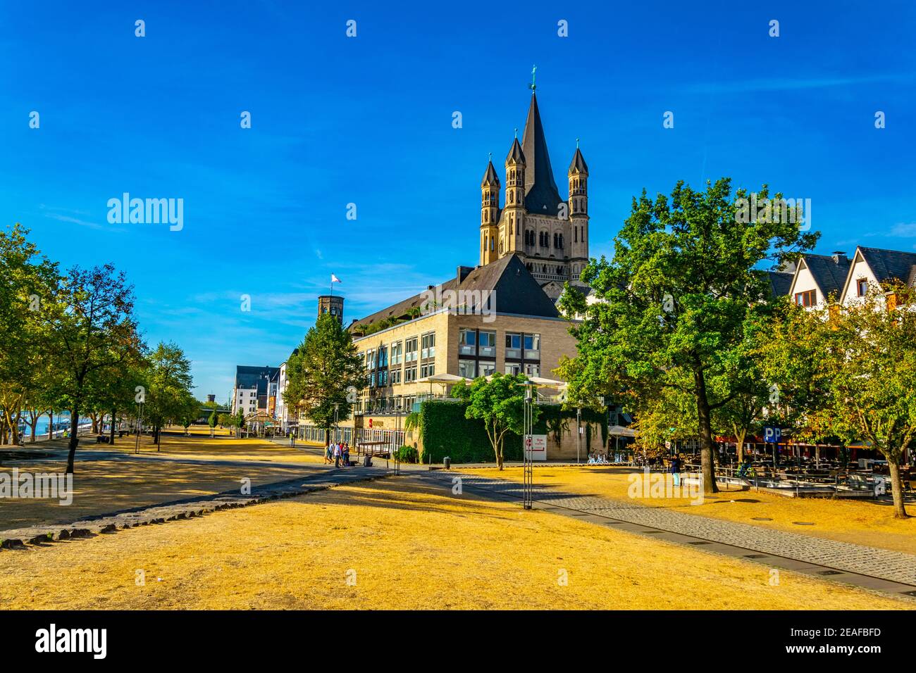 Riverside promenade and Saint Martin church in Cologne, Germany Stock ...