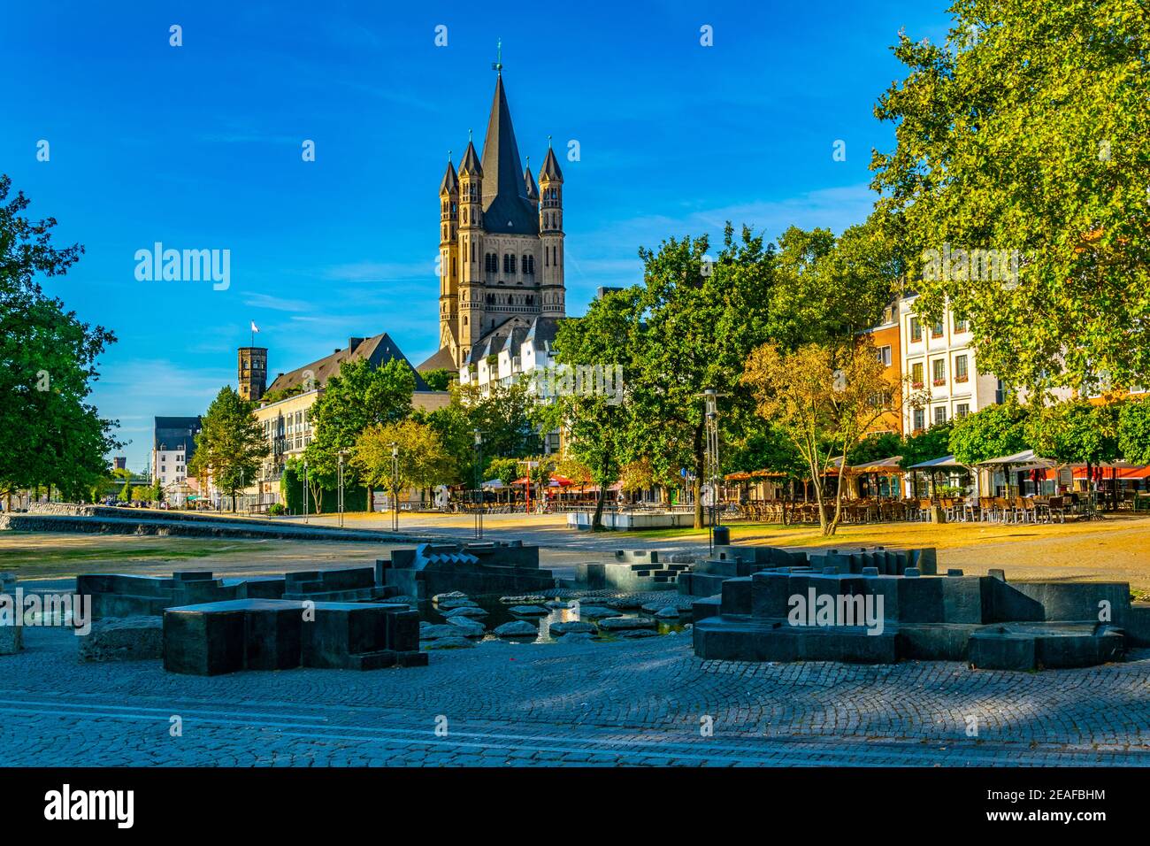 Riverside promenade and Saint Martin church in Cologne, Germany Stock ...