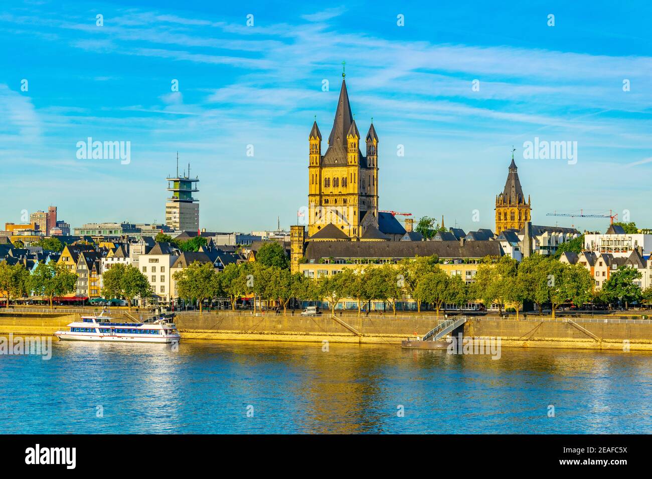 Riverside promenade and Saint Martin church in Cologne, Germany Stock ...
