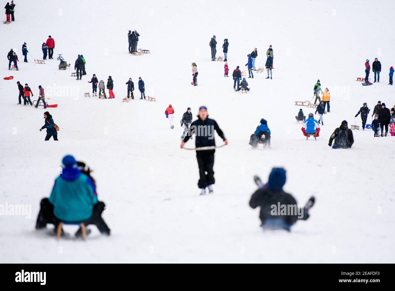 February 9, 2021, Berlin, Berlin, Germany: People sled on a slope at ...