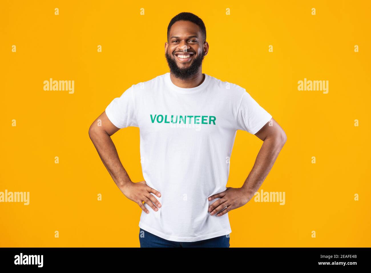 Cheerful African Volunteer Guy Standing Posing On Yellow Background ...