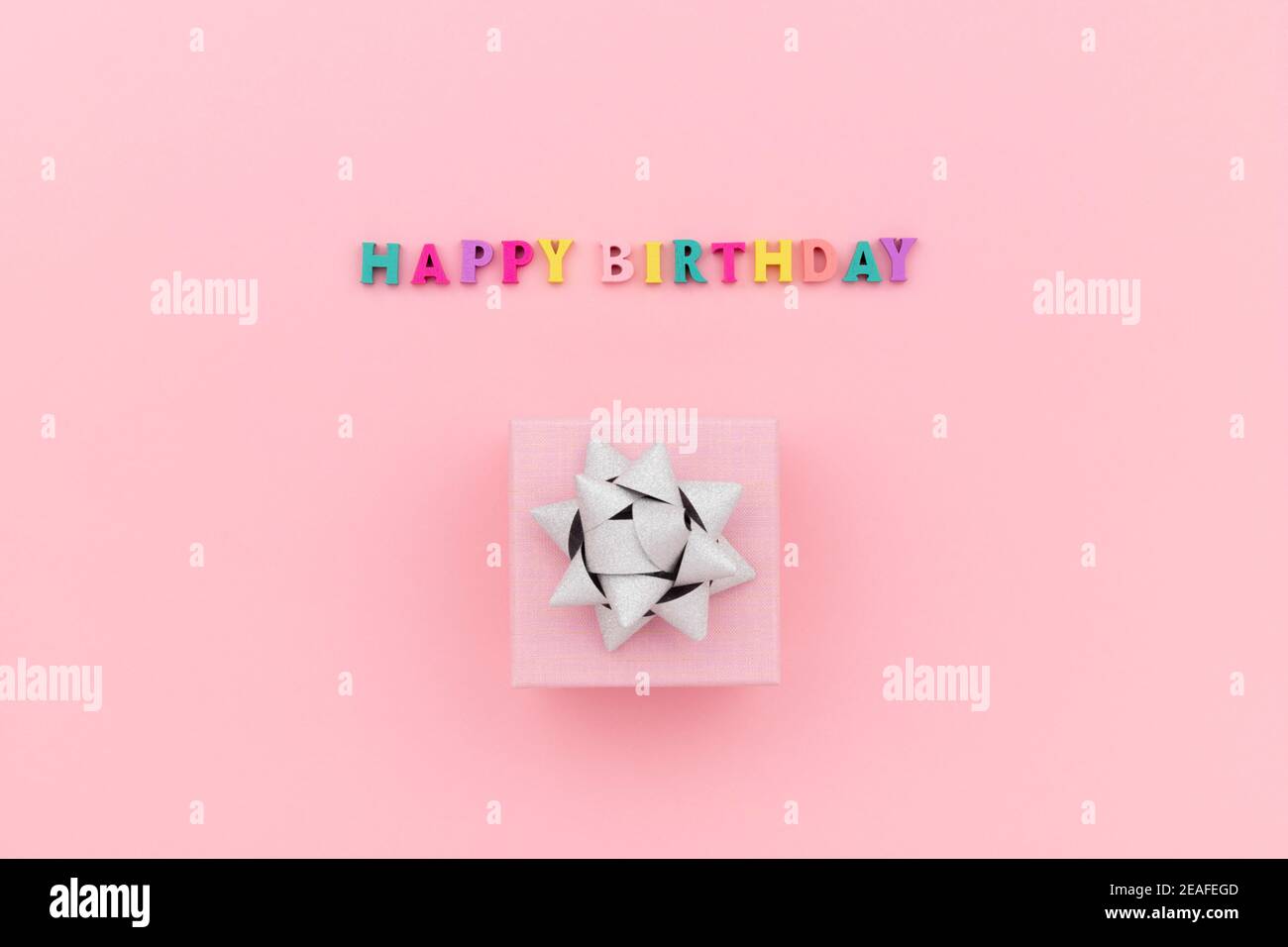 Happy birthday inscription from wooden colorful letters with gift box ...