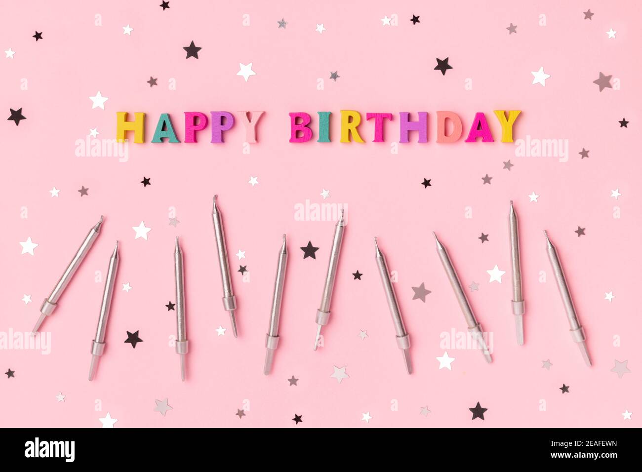 Happy birthday inscription from wooden colorful letters with confetti ...