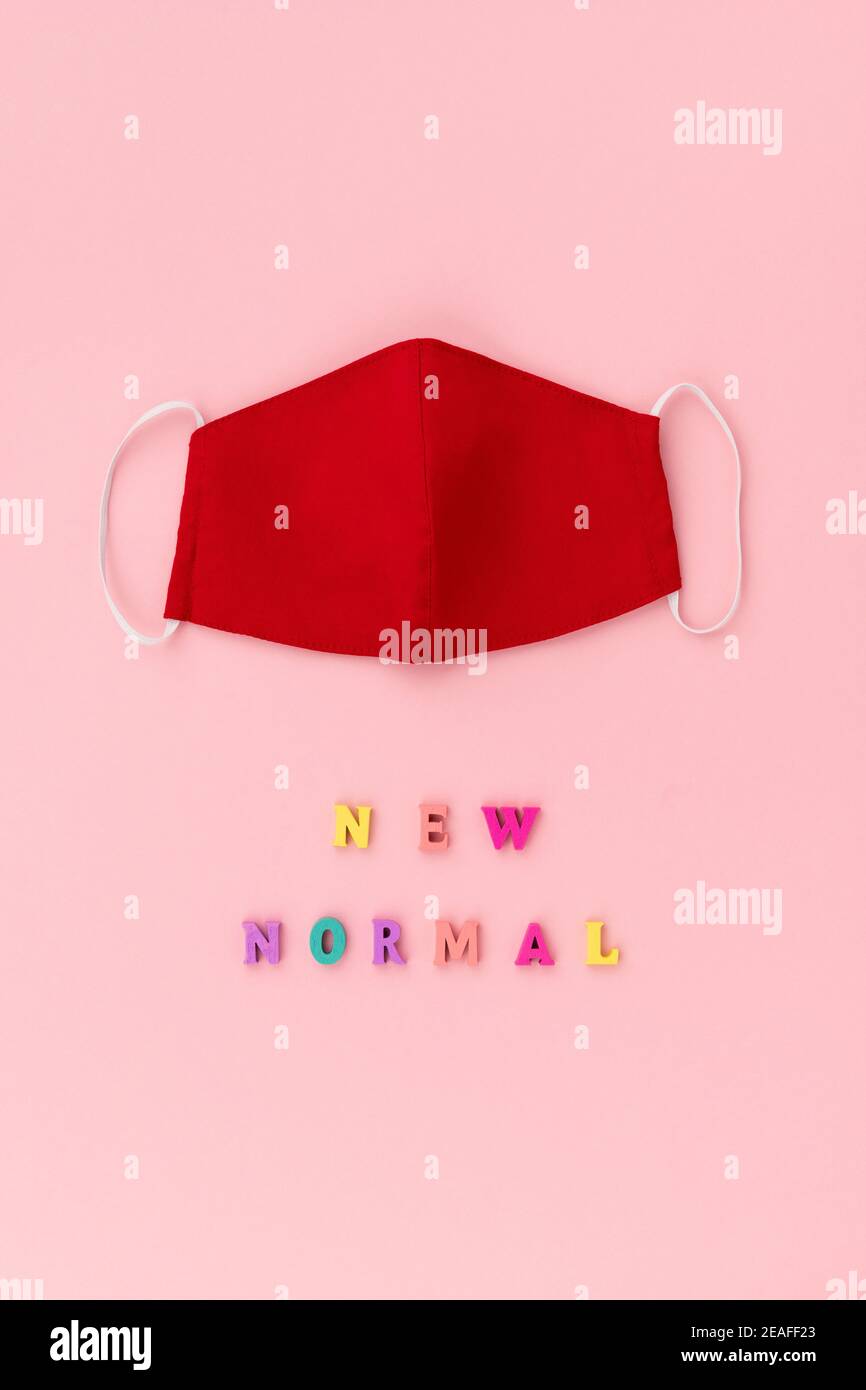 Non-medical face covering mask with inscription new normal Stock Photo ...