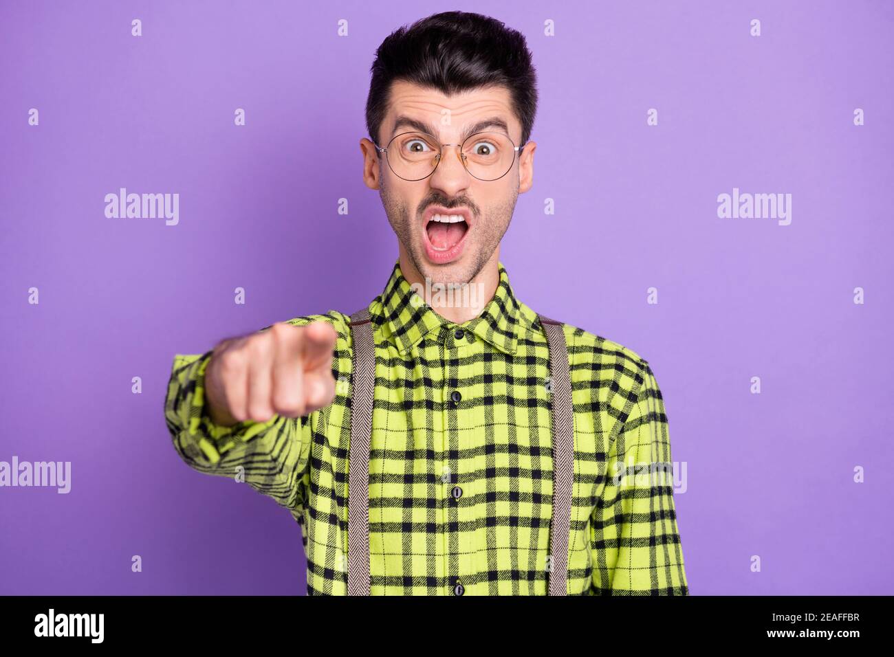 Photo portrait of angry guy pointing finger at you isolated on vivid ...