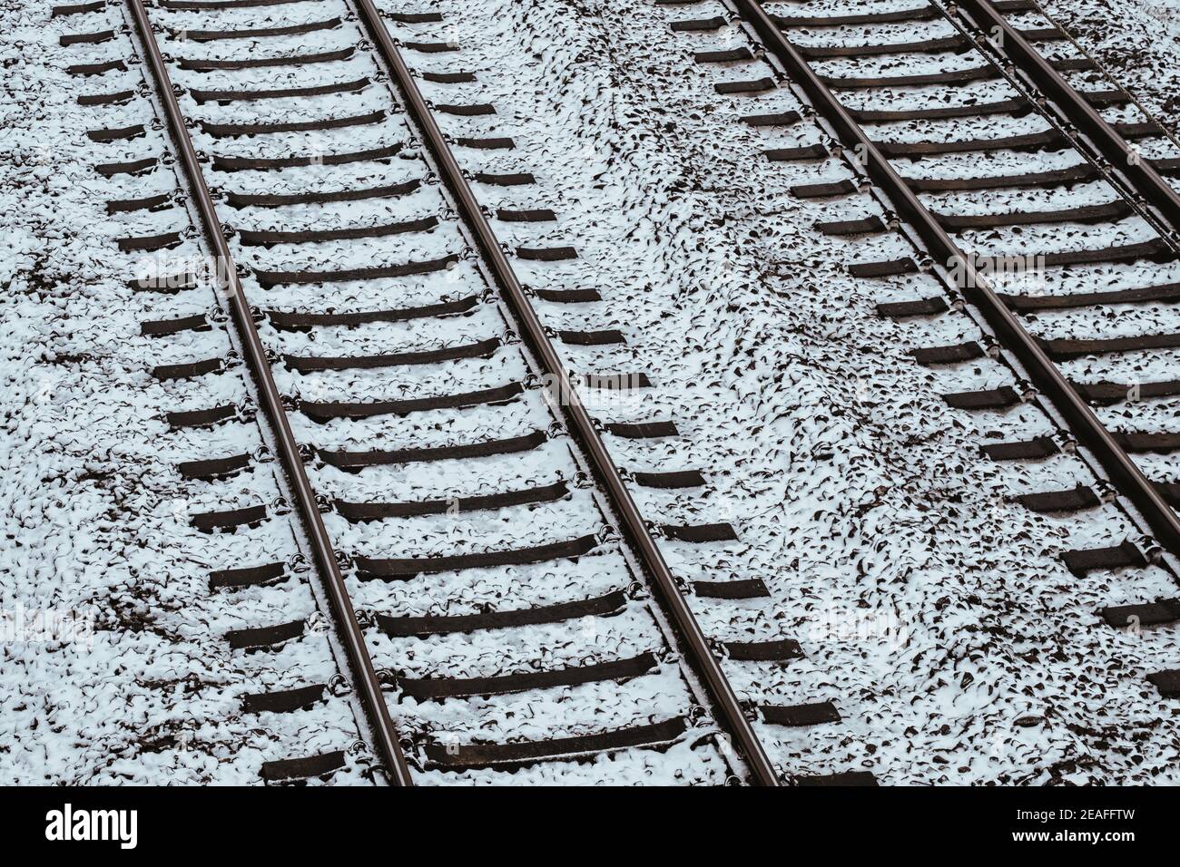 Rails of a train covered by snow in winter Stock Photo - Alamy