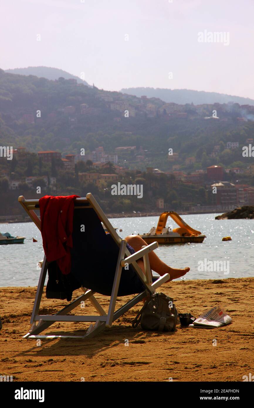 Vertical shot person sunbathing hi-res stock photography and images - Alamy