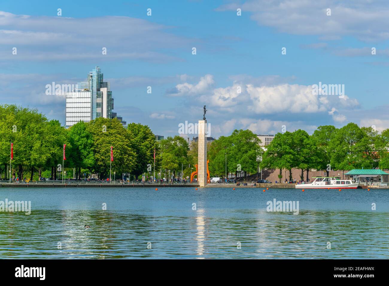 Statue of a runner with olympic torch alongside Maschsee in Hannover ...