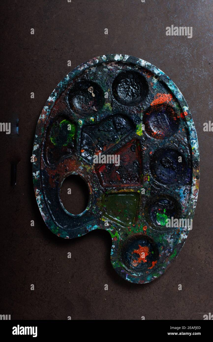 Vertical shot of a color palette on a brown backgrou Stock Photo - Alamy