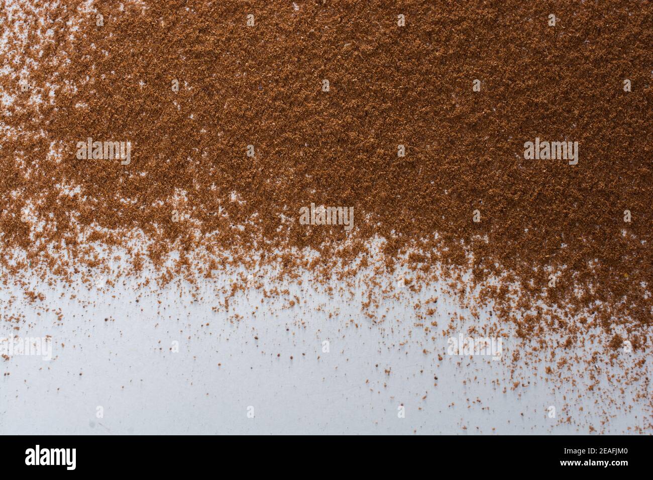 Overhead shot of cocoa powder on a white background Stock Photo - Alamy