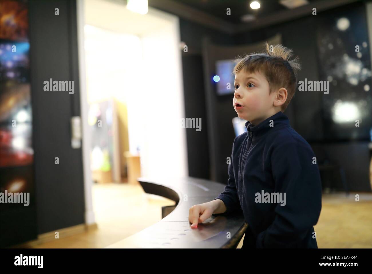 Child pushing button hi-res stock photography and images - Alamy