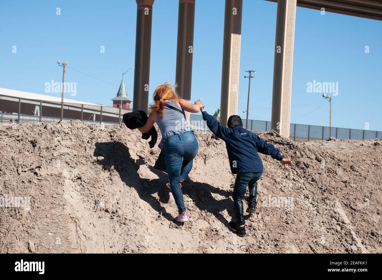 A Central American woman and her son cross the Rio Grande to surrender ...