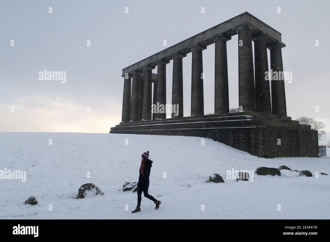 People walking around Calton Hill after a heavy snowfall in Edinburgh ...
