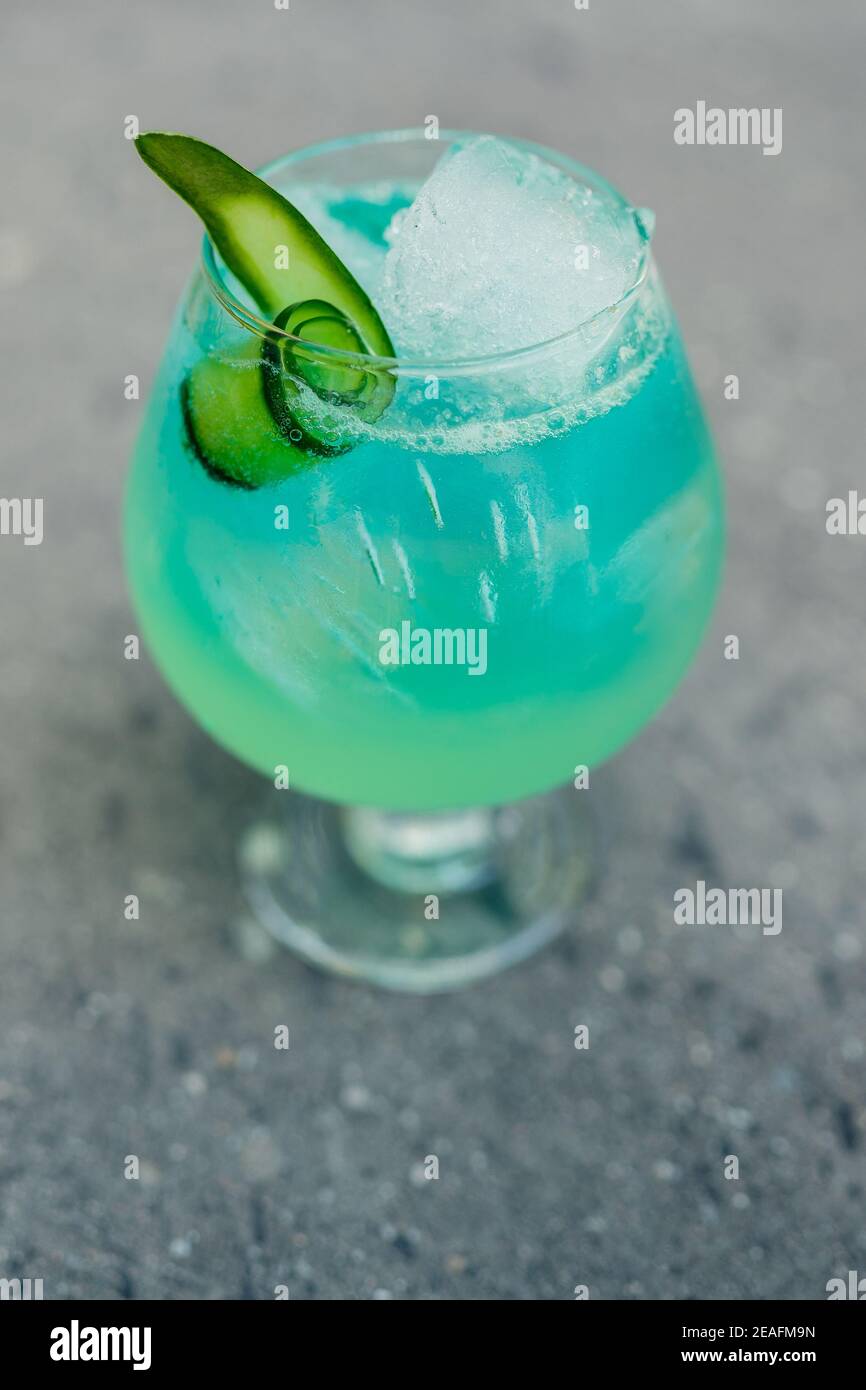 Closeup shot of blue curacao liqueur on a blurred background Stock ...