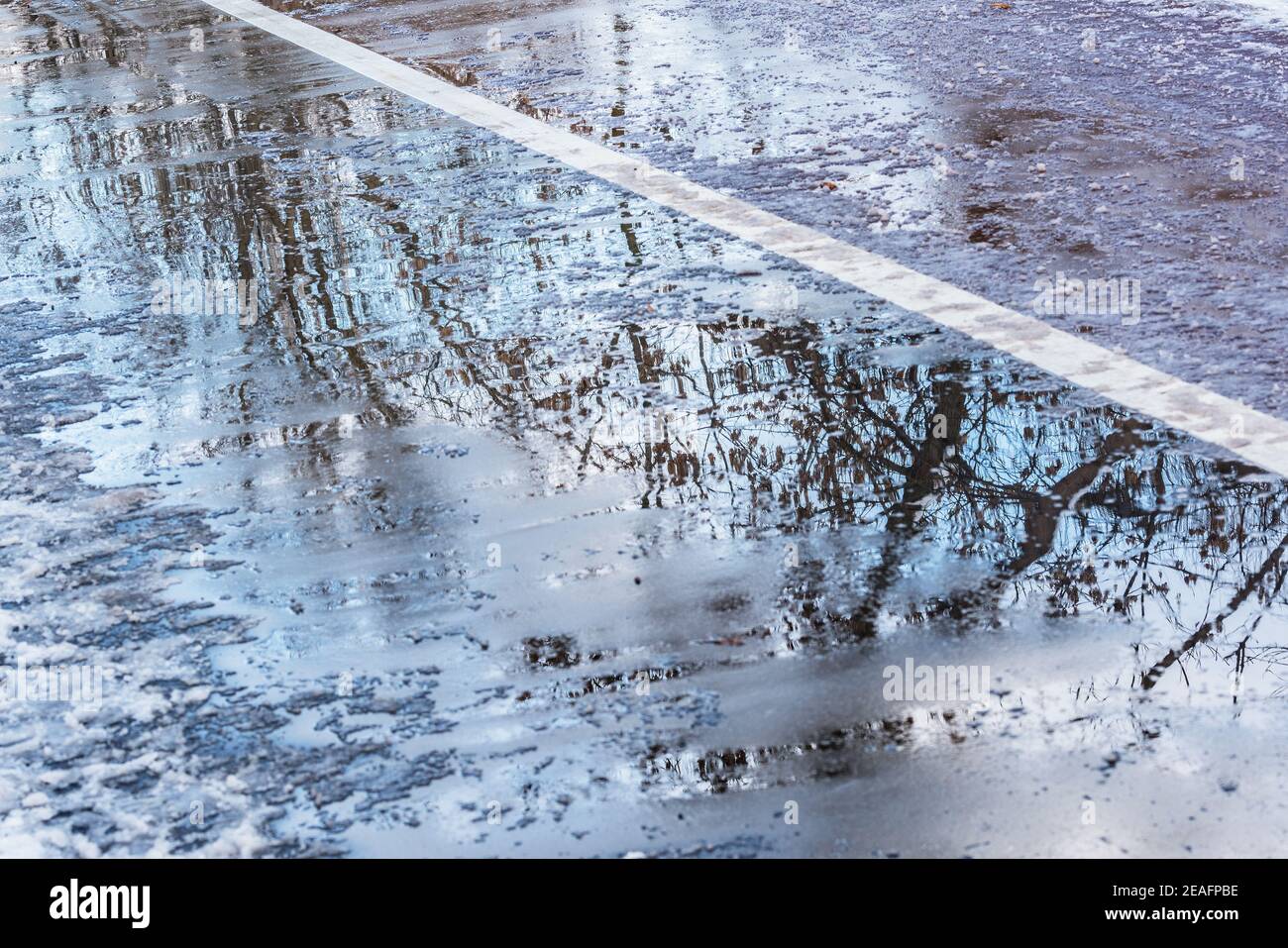 Wet asphalt road surface at winter morning Stock Photo - Alamy