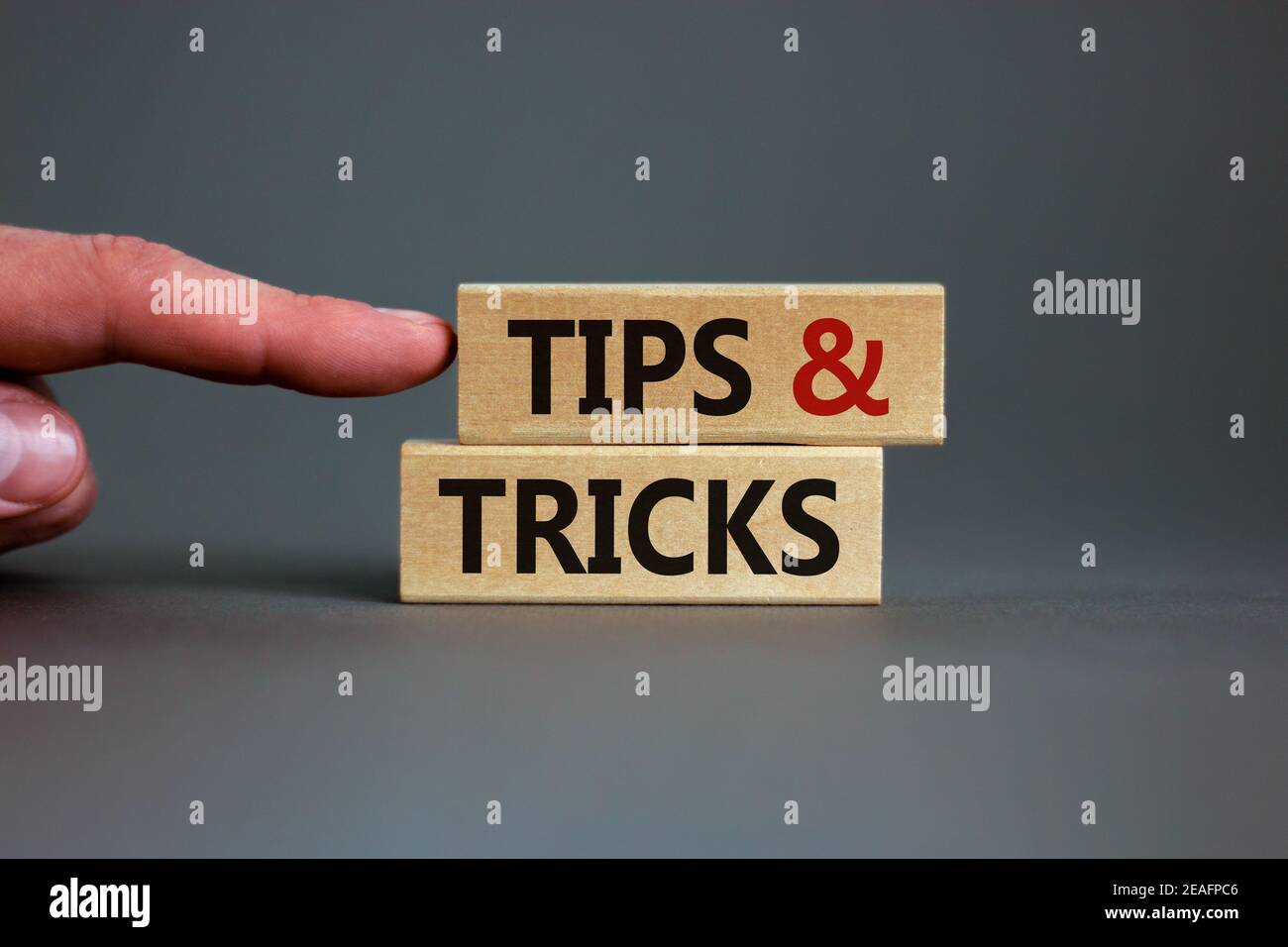Tips and tricks symbol. Wooden blocks with words 'Tips and tricks ...