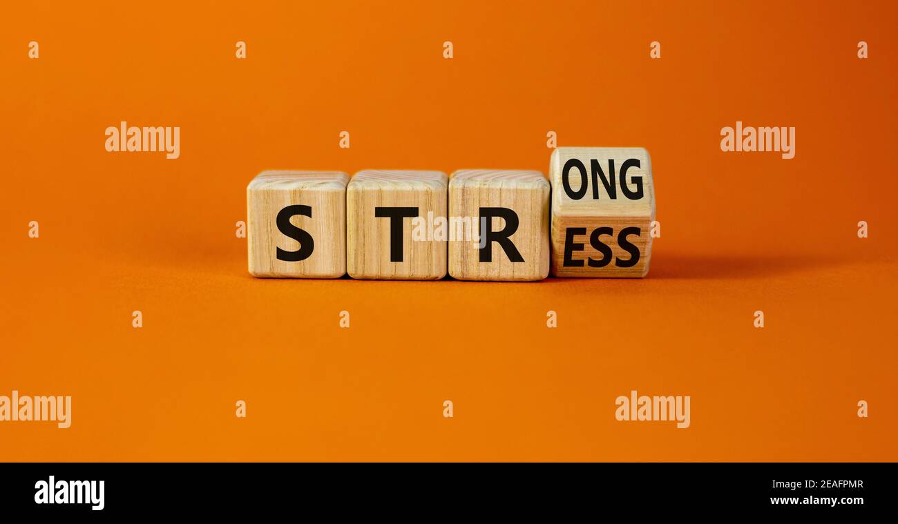 Strong stress symbol. Turned wooden cubes with words 'strong stress ...