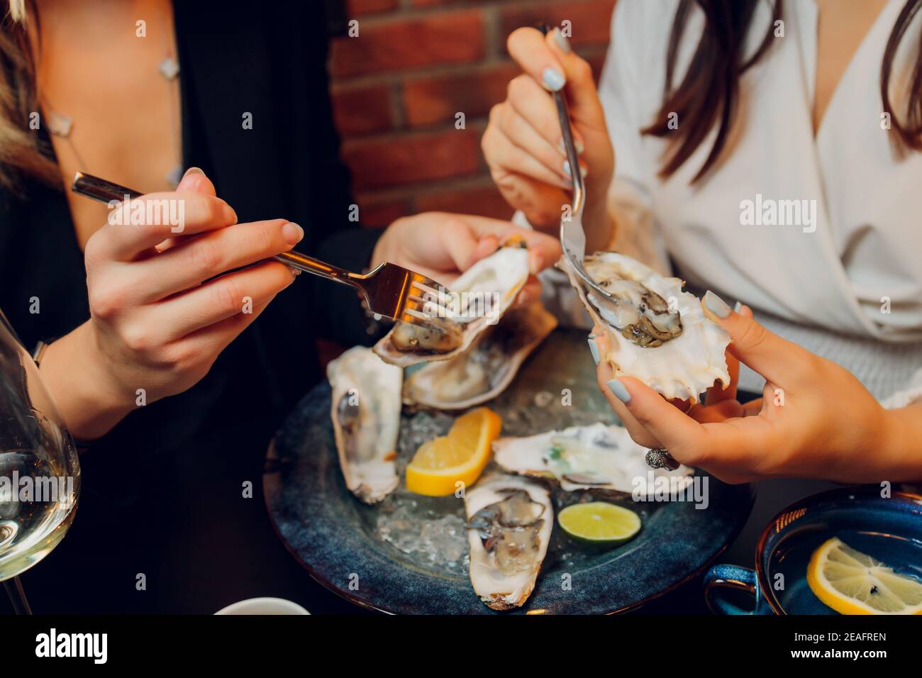 Table seafood hands beach hi-res stock photography and images - Alamy