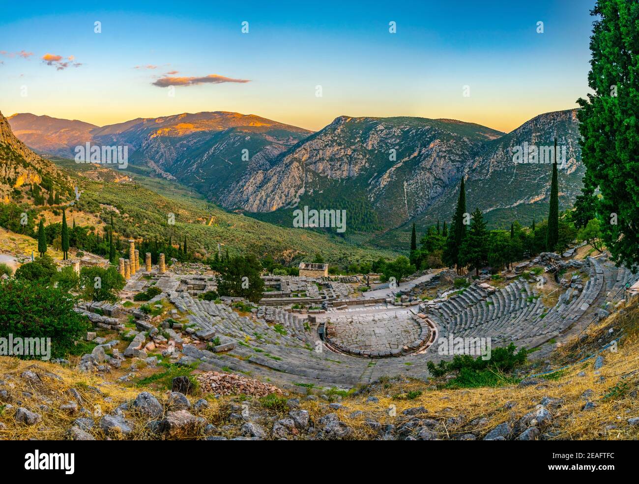 Sunset view of ruins of theatre at ancient Delphi, Greece Stock Photo ...