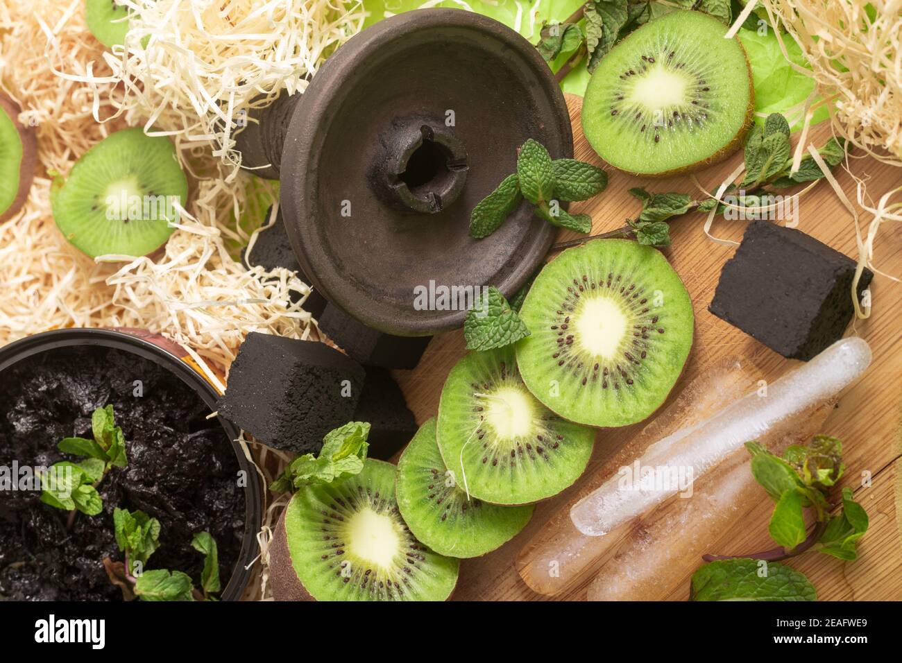 Hookah shisha tobacco kiwi taste with ice next Stock Photo - Alamy