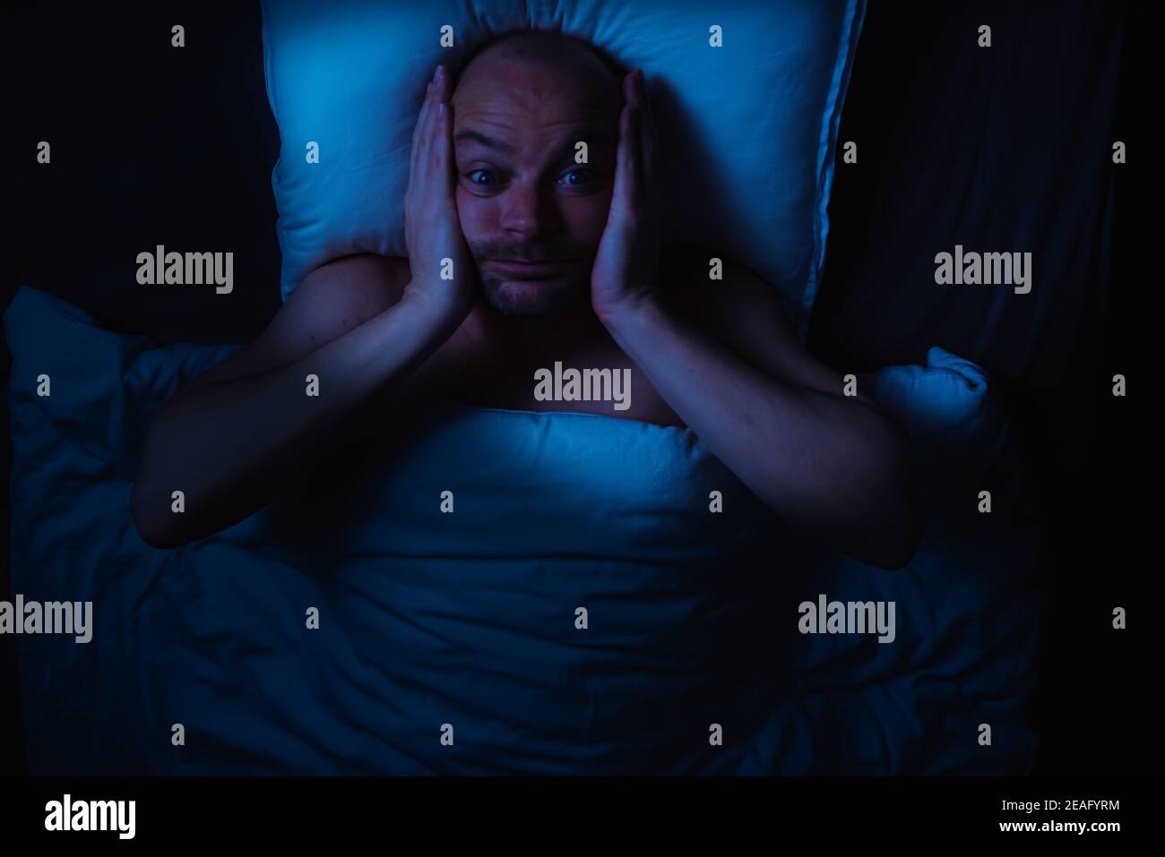 Man in bed cant sleep staring at the ceiling Stock Photo - Alamy