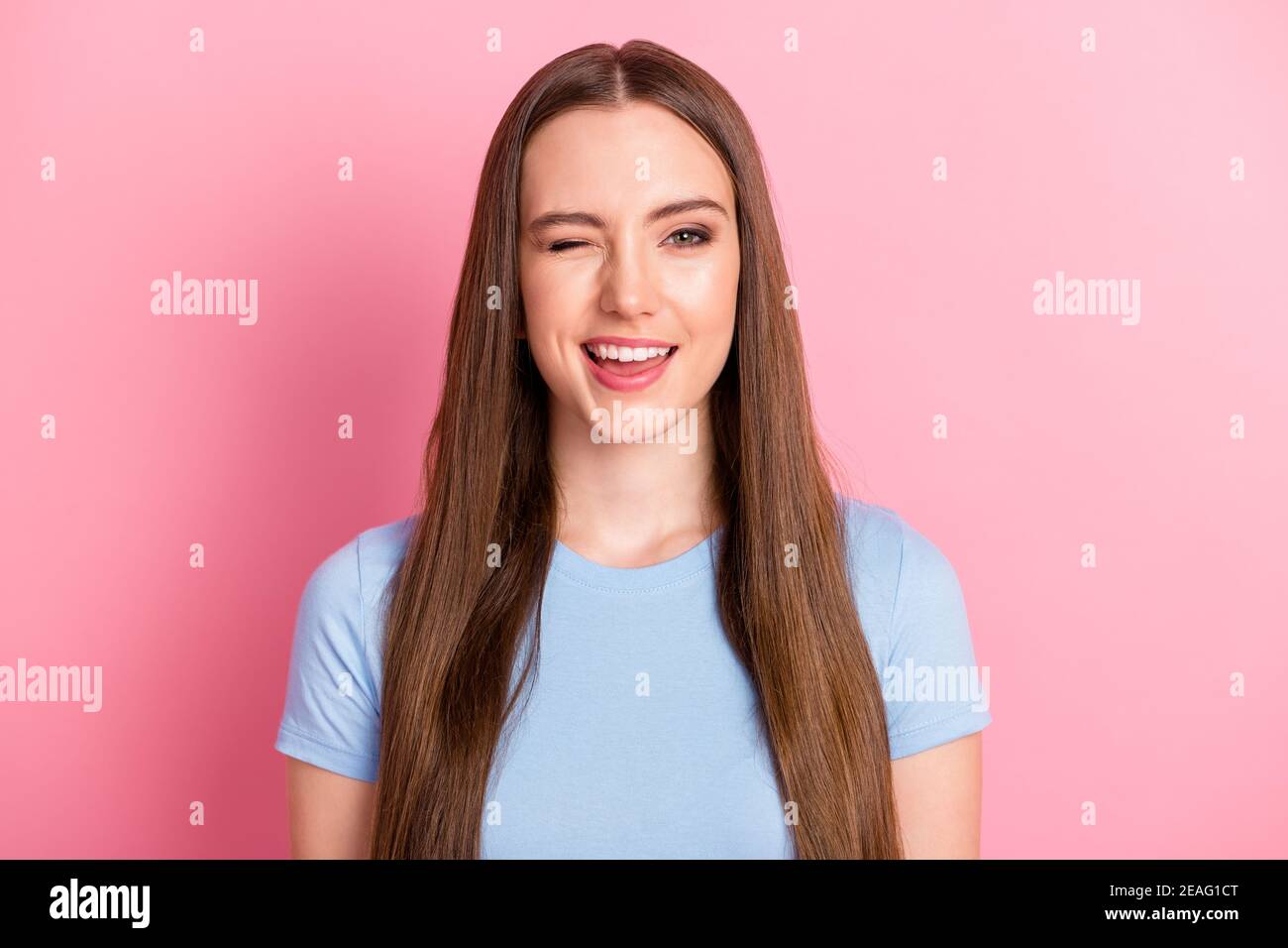 Photo portrait of winking girl isolated on pastel pink colored ...