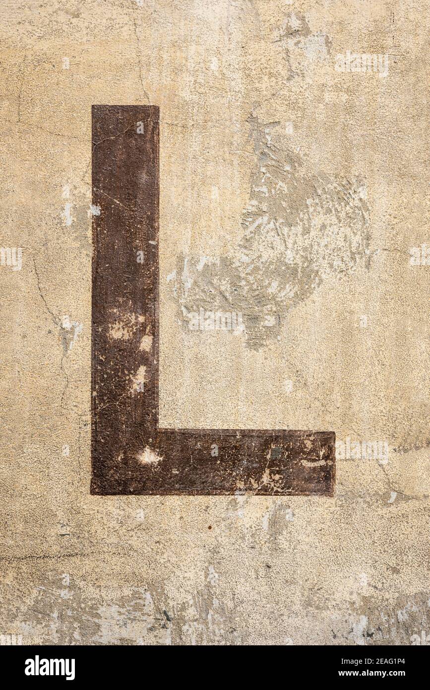Painted letter L on a weathered house wall Stock Photo - Alamy