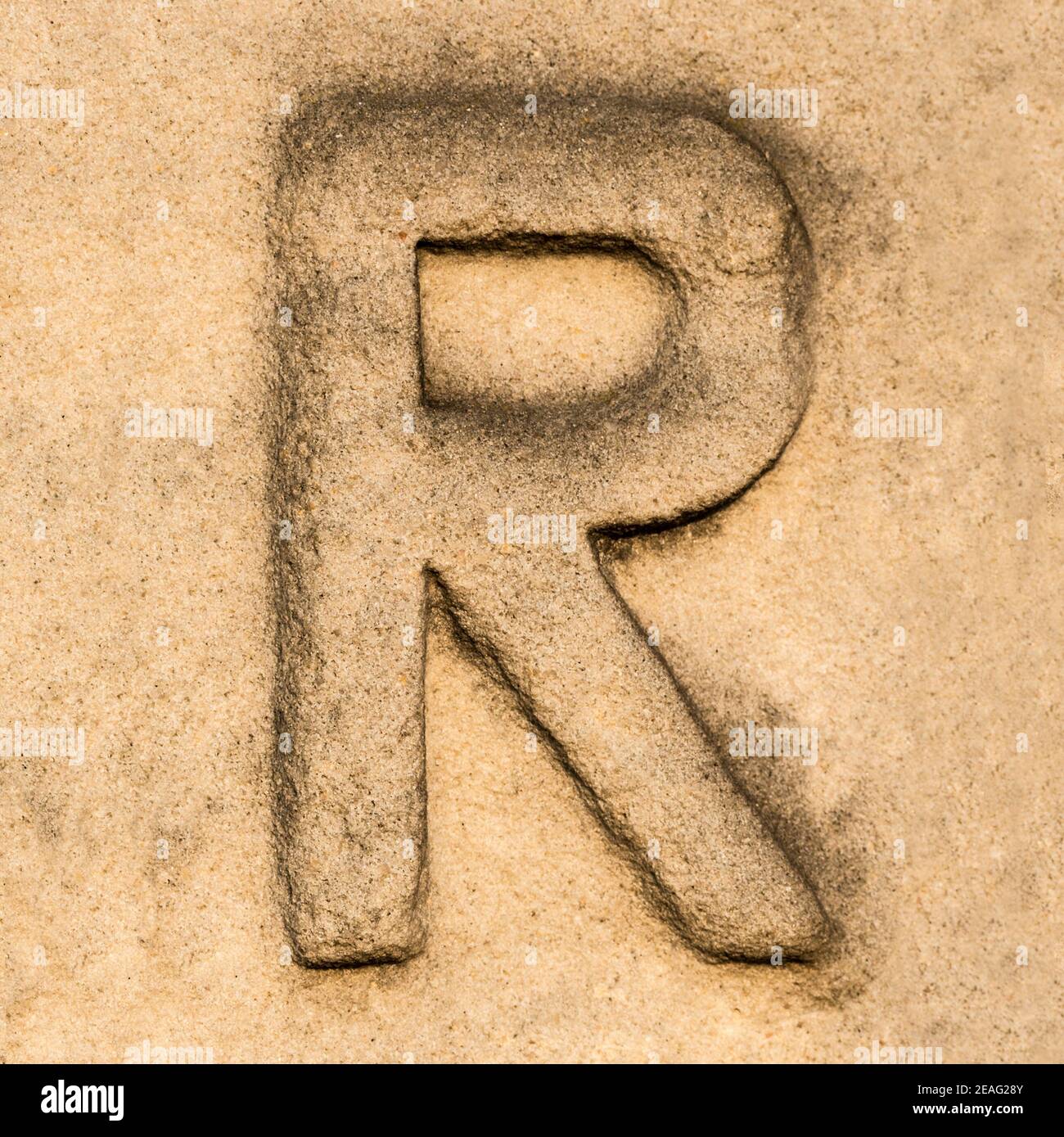 Weathered sandstone letter R Stock Photo - Alamy