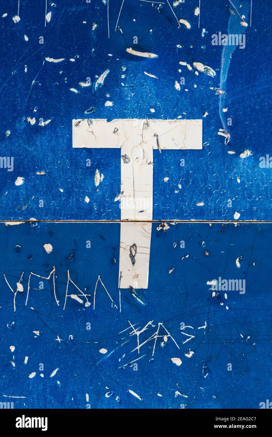 White letter T on a blue traffic sign Stock Photo - Alamy