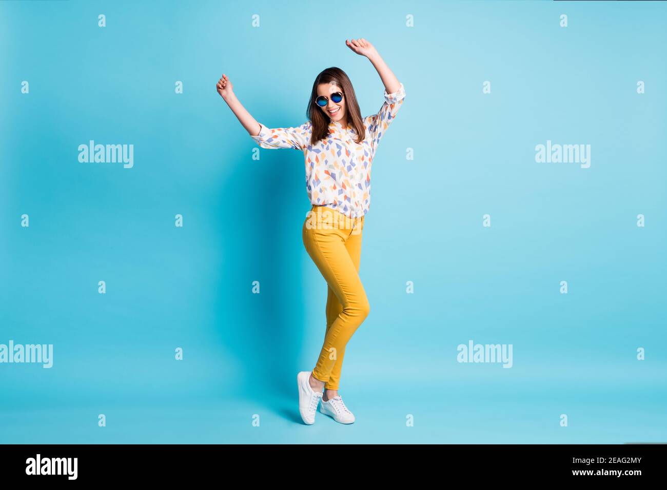 Full length body size photo of happy smiling girl dancing on dancefloor ...