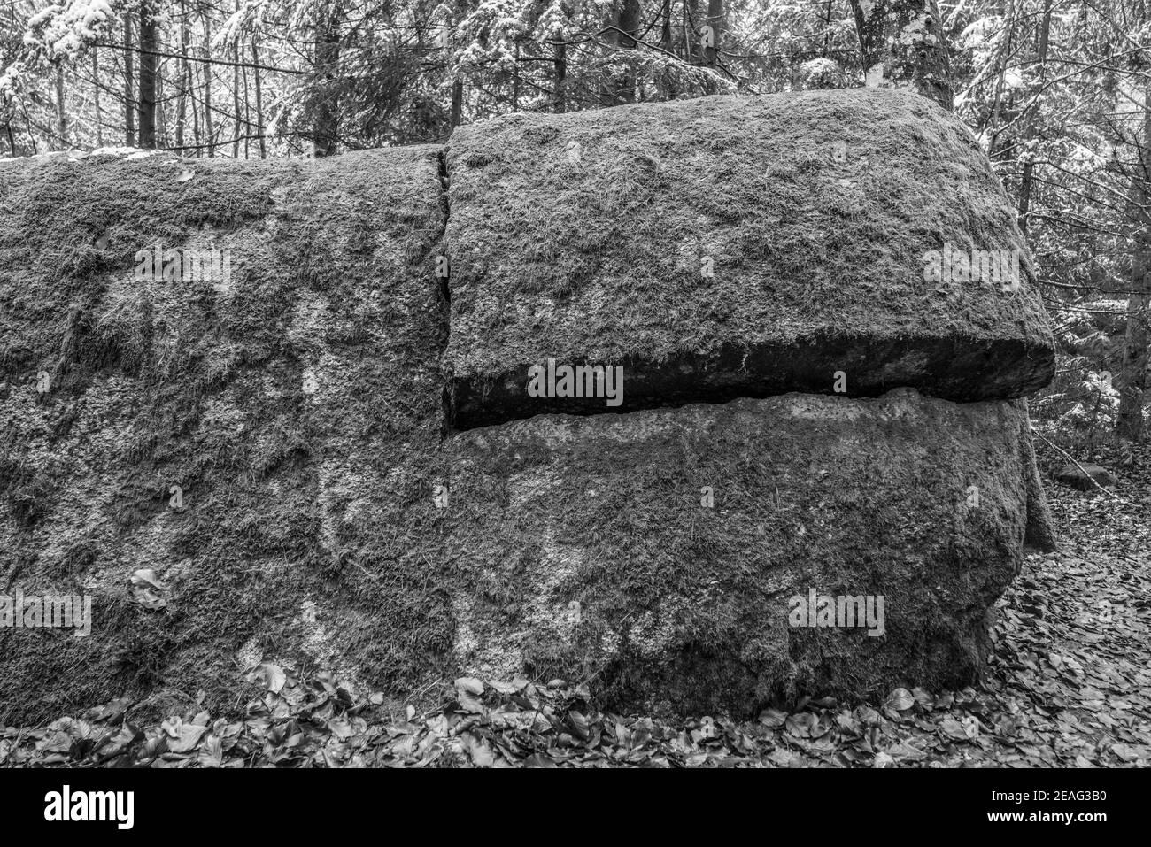 Ancient weathered megalithic granite rock formation with cave and ...