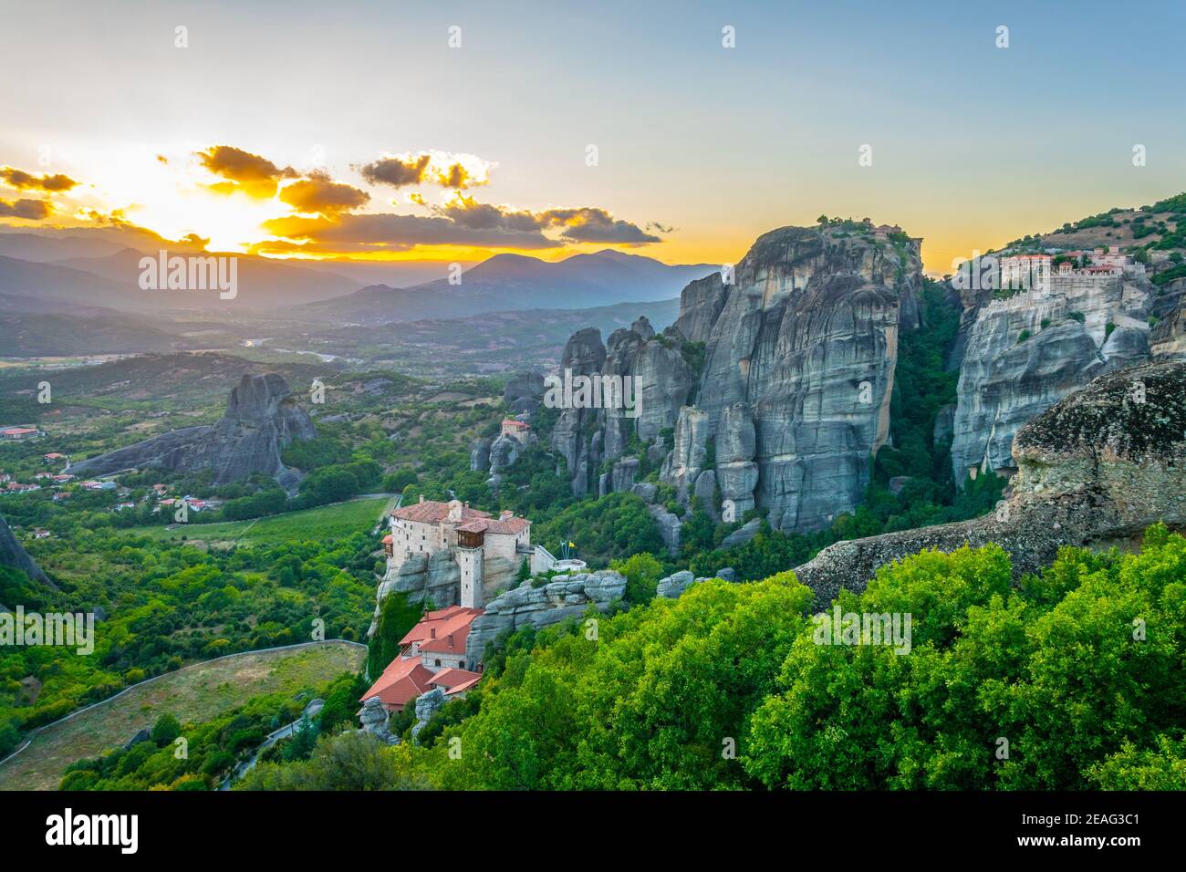 Sunset over Meteora in Greece Stock Photo - Alamy