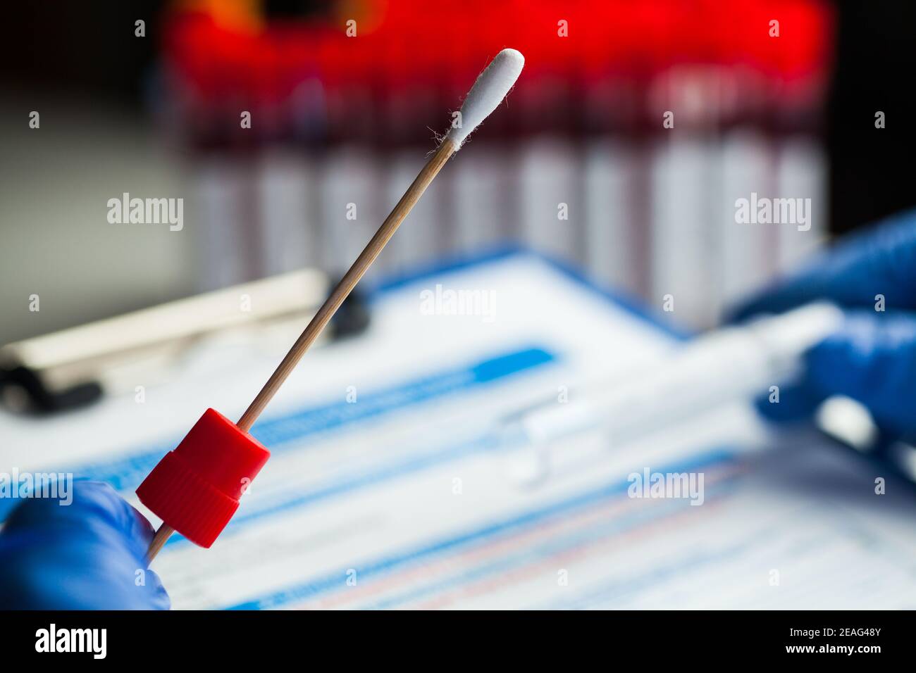 Lab scientist holding COVID-19 test kit,laboratory specimen collection ...