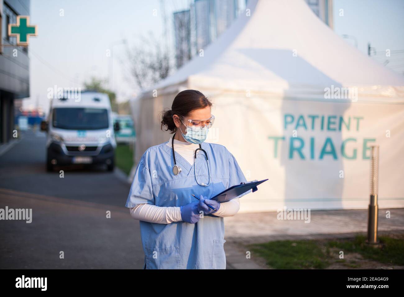 Female key doctor checking patient report form medical card,standing ...