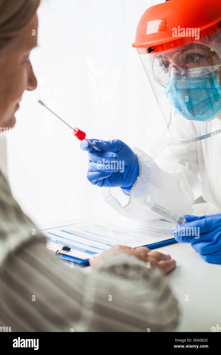 COVID-19 rt-PCR test procedure,medical worker in PPE wearing hazmat ...