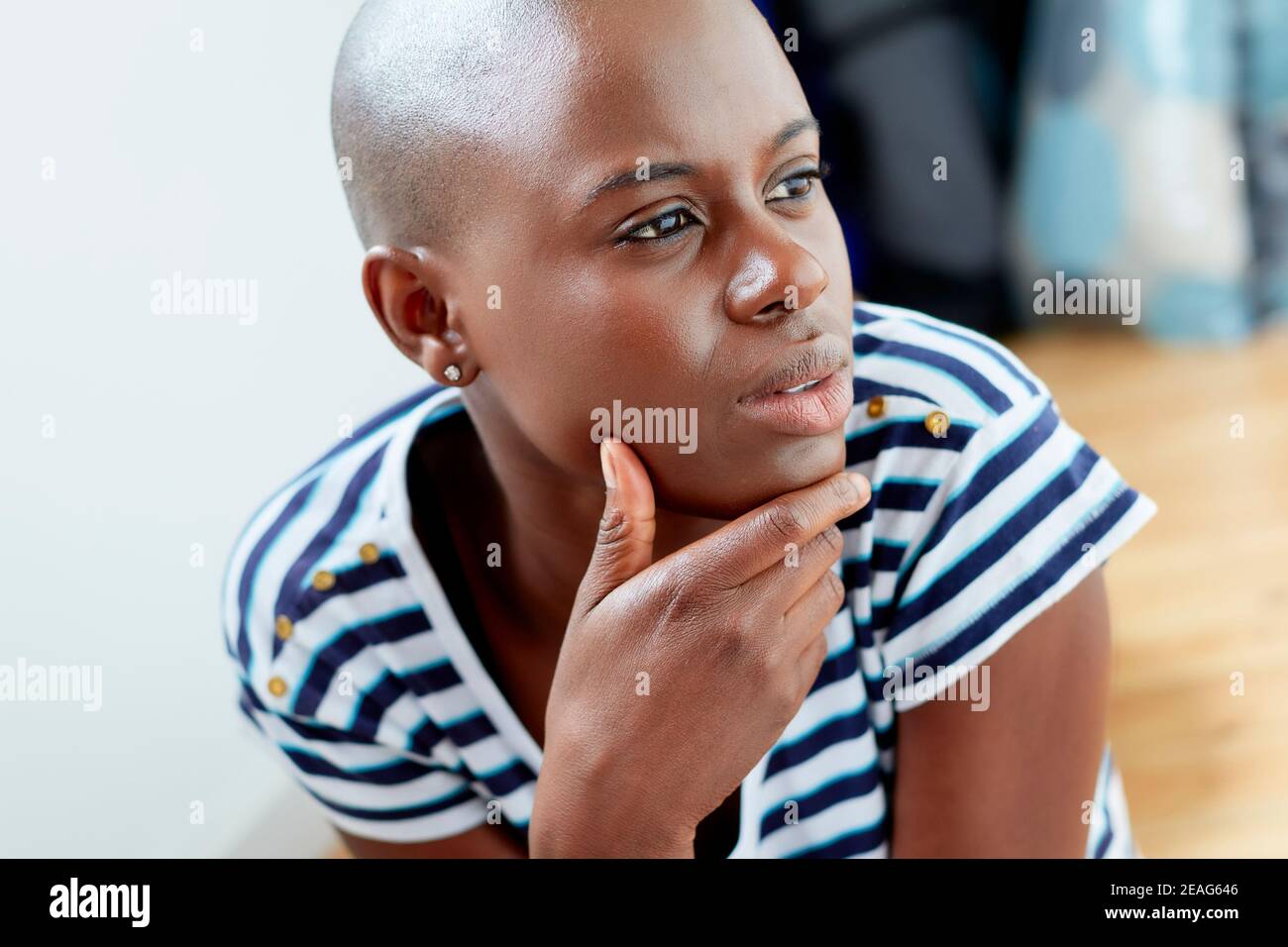 Ethnic Student girl sat on the floor studying Stock Photo - Alamy