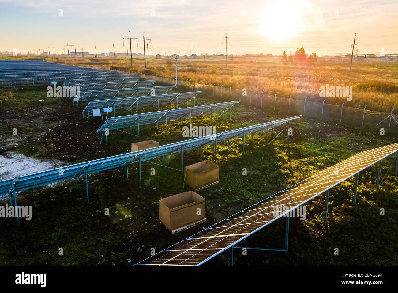 Aerial view of solar power plant under construction on green field ...