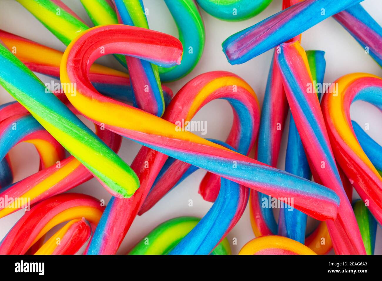 Red And White Striped Candy Canes On A Peppermint Background High ...