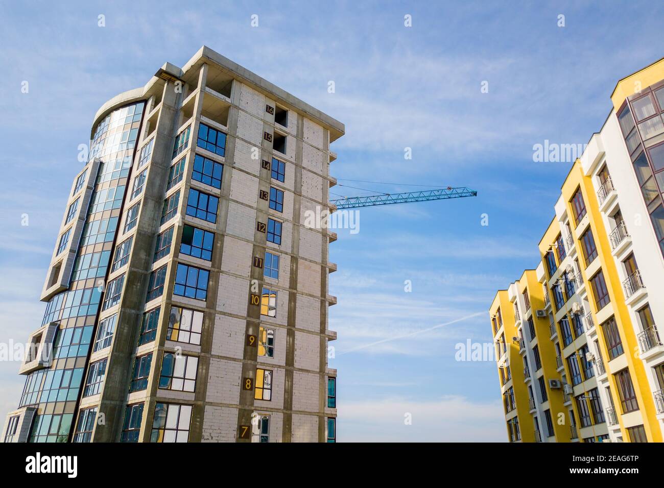 Aerial view of high residential apartment building with storey numbers ...