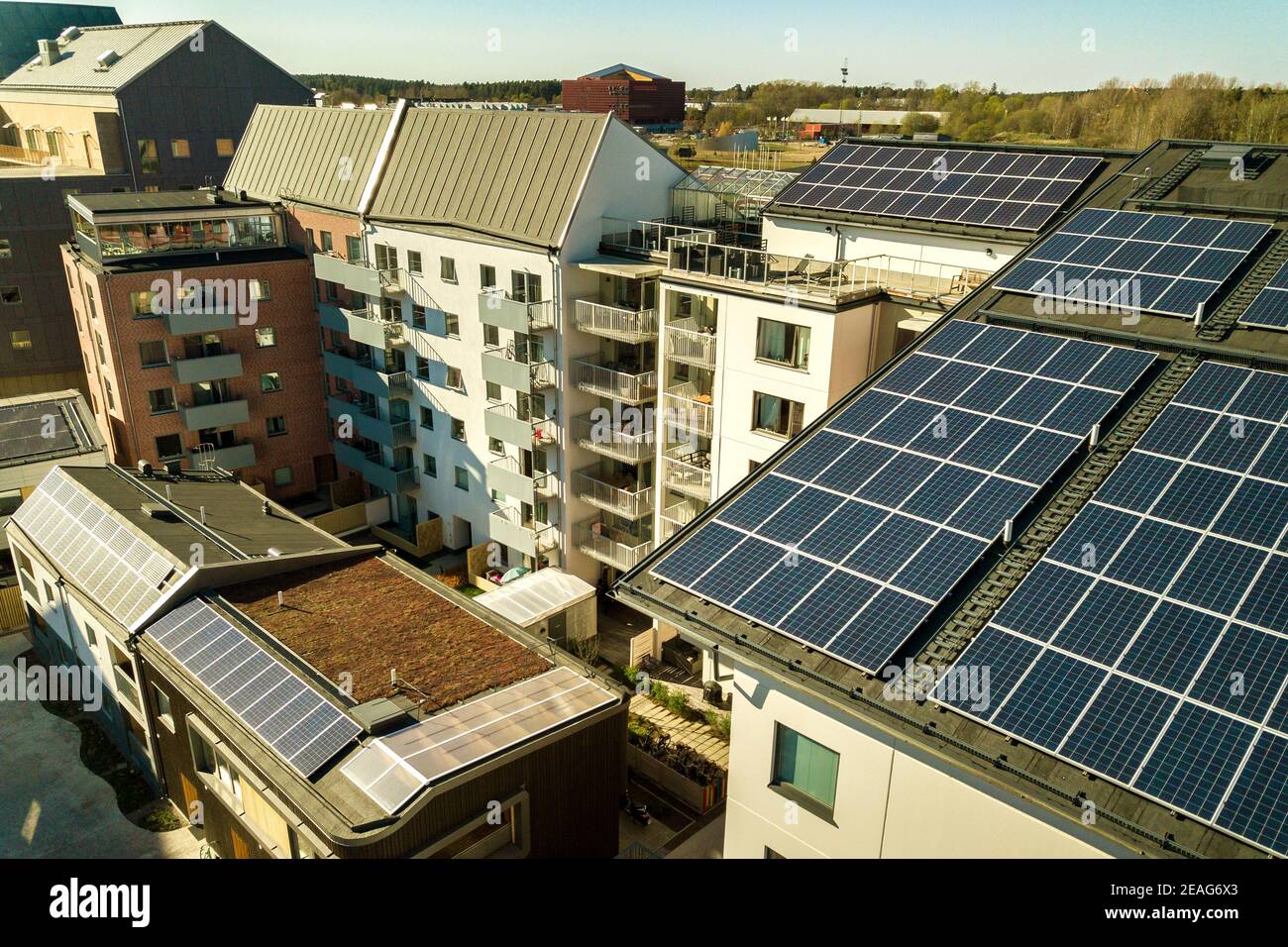 Aerial view of solar photovoltaic panels on a roof top of residential ...