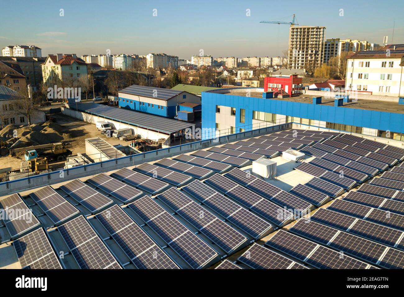Aerial view of many photo voltaic solar panels mounted of industrial ...