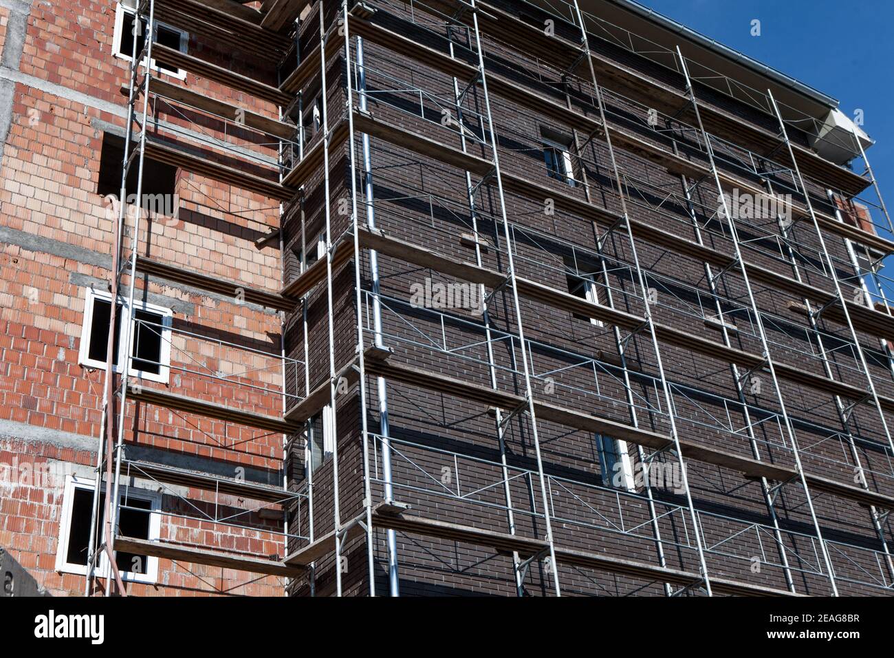 Low angle shot of a residential building construction Stock Photo - Alamy
