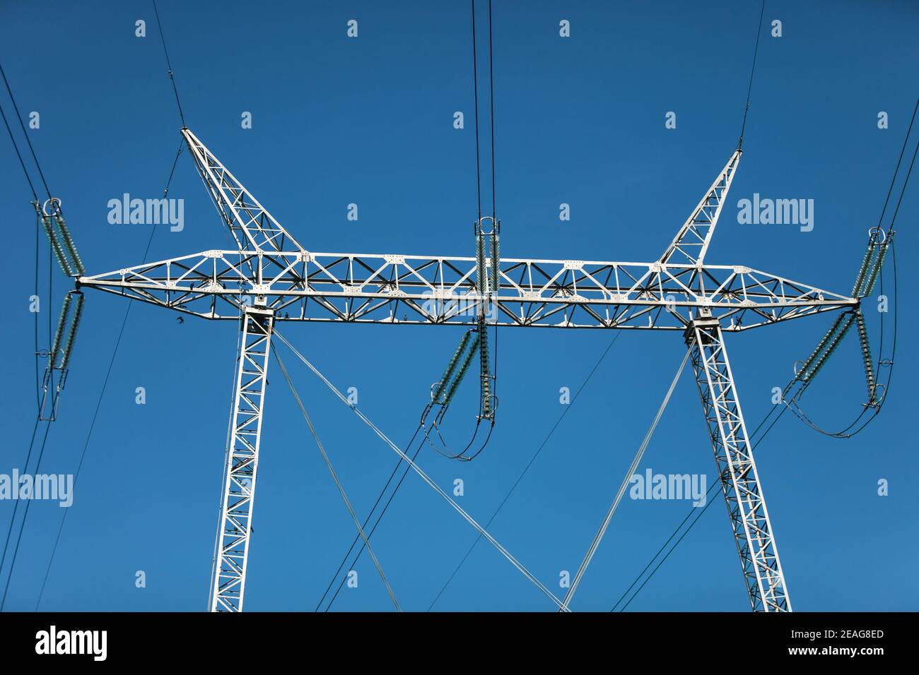 Low angle shot of overhead high-voltage power lines Stock Photo - Alamy