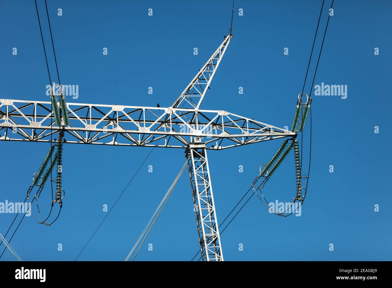 Low angle shot of overhead high-voltage power lines Stock Photo - Alamy